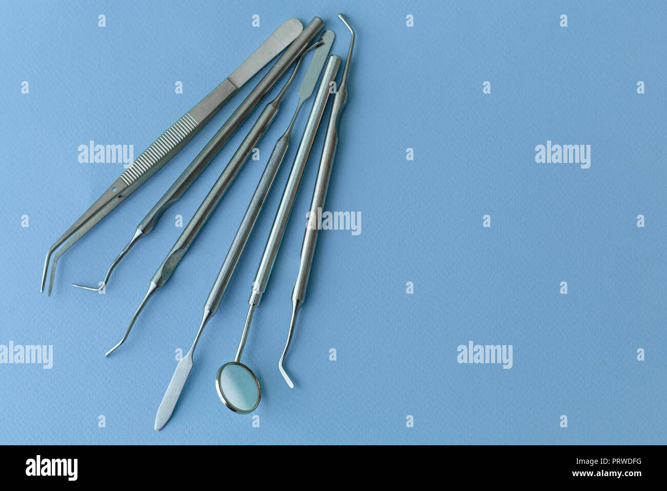 Professional Dentist tools in dental office: dentist mirror, forceps ...