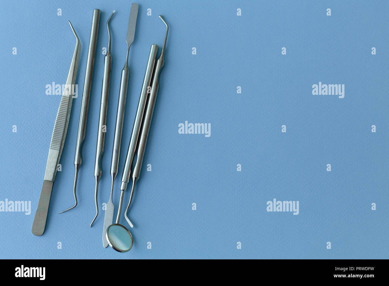 Professional Dentist tools in dental office: dentist mirror, forceps ...