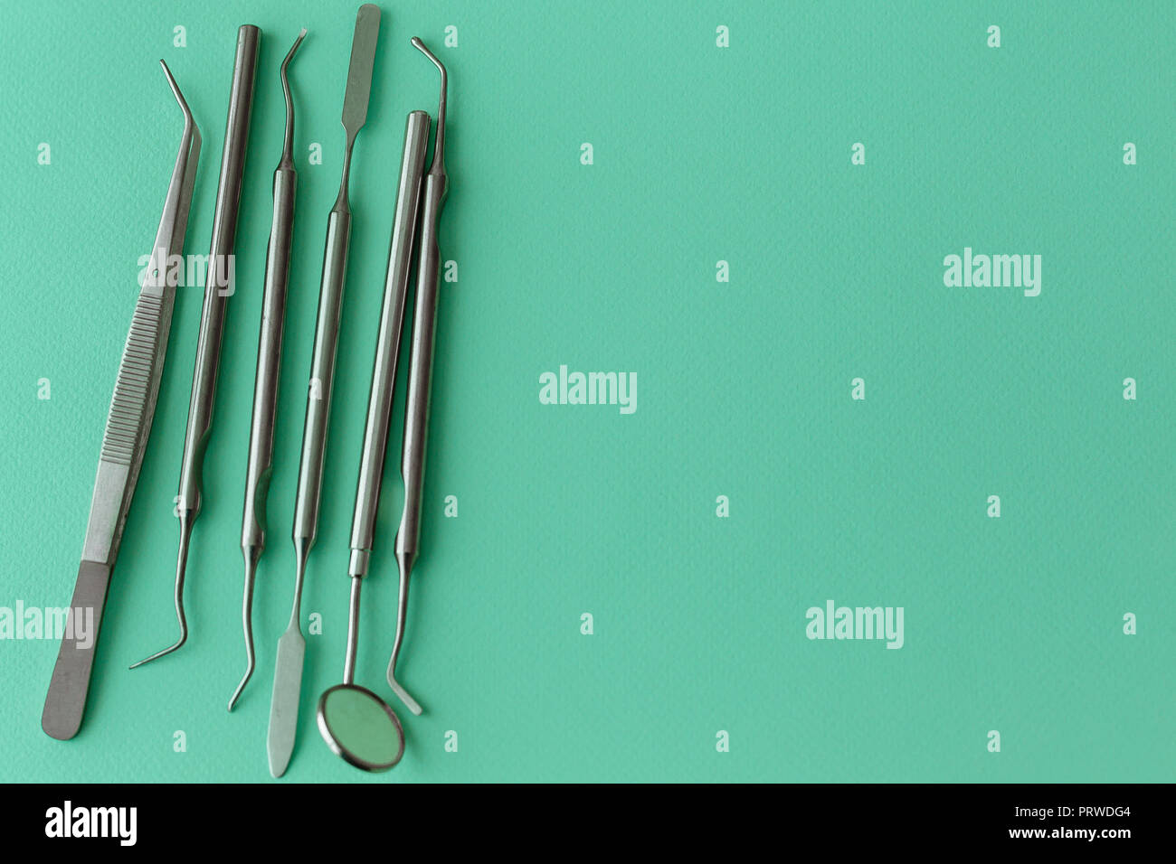 Professional Dentist tools in dental office: dentist mirror, forceps ...