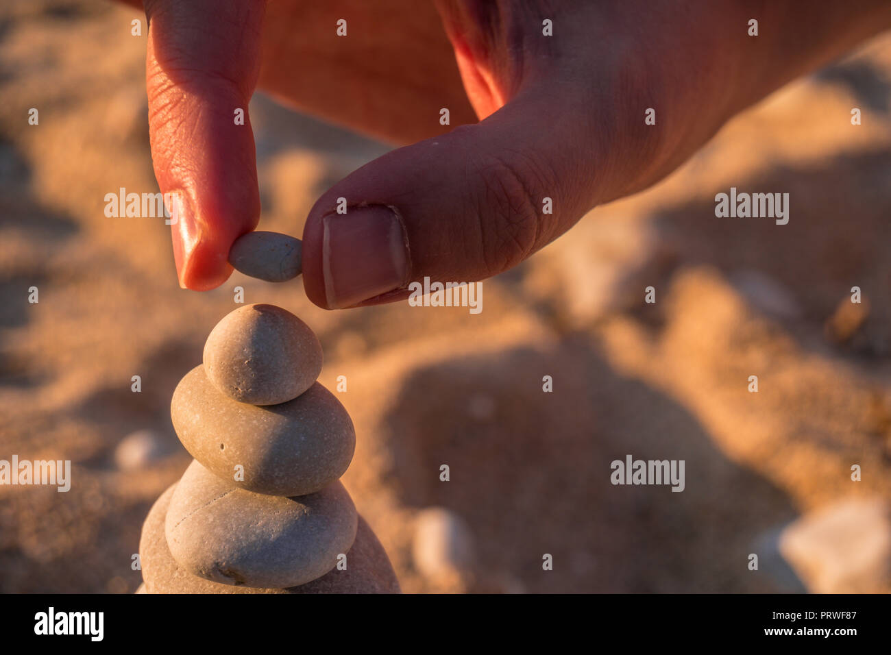 Hand building pyramid hi-res stock photography and images - Alamy