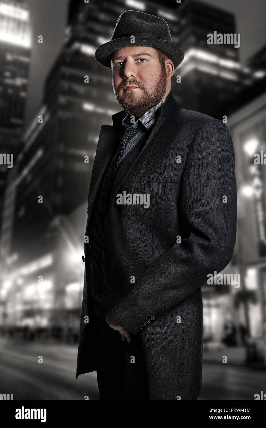 Film noir. Retro style fashion portrait of a detective. A man in a suit ...