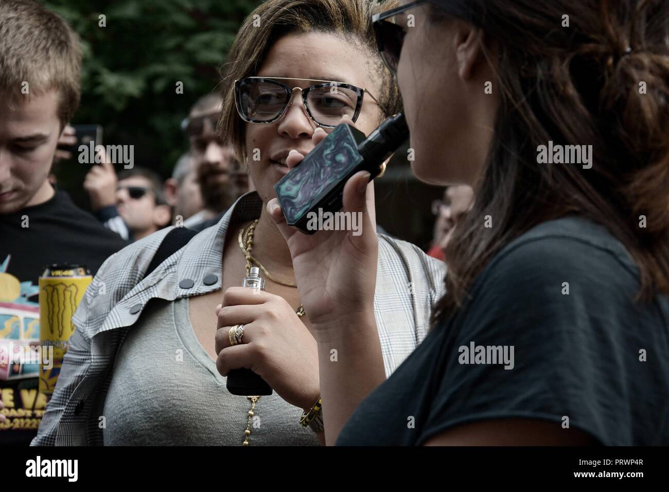 Athens, Greece. 4th Oct, 2018. A protester seen smoking vapor cigarette ...