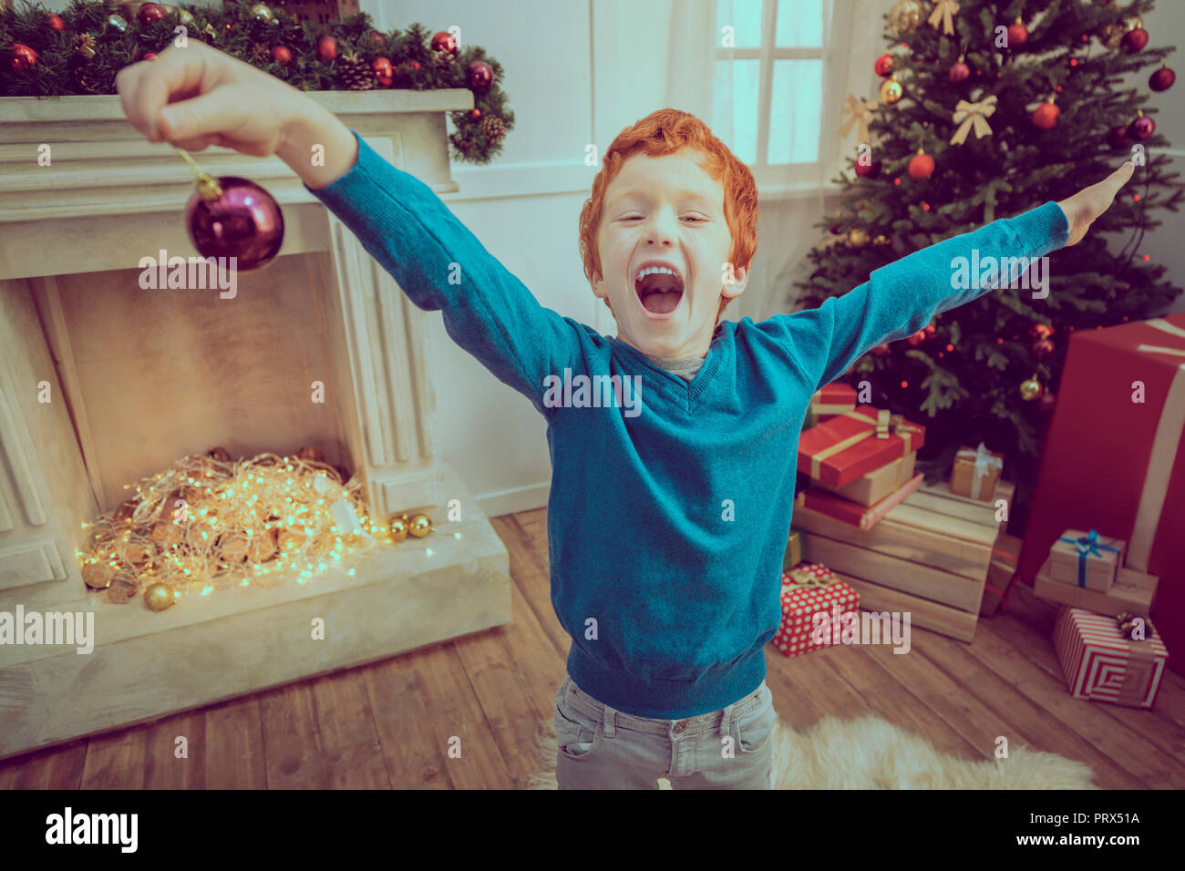 Happy boy showing his emotions Stock Photo - Alamy