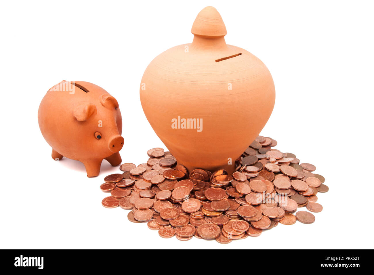 Clay piggy bank with coins on a white background Stock Photo - Alamy
