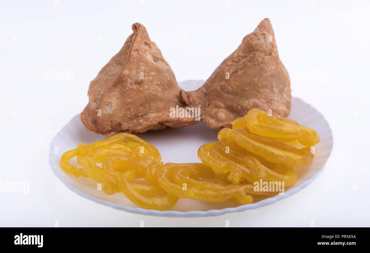 Samosa and jalebi Indian fried food dish on a plate mumbai india Stock ...