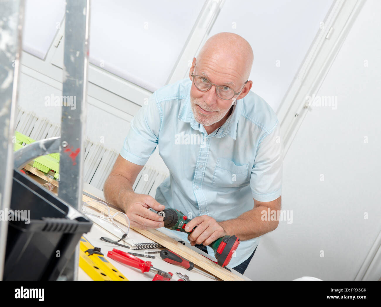 Handyman mature home improvement working hi-res stock photography and ...