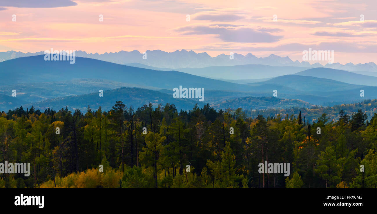 Wide angle panorama autumn forest,misty hills mountain tops in pink ...