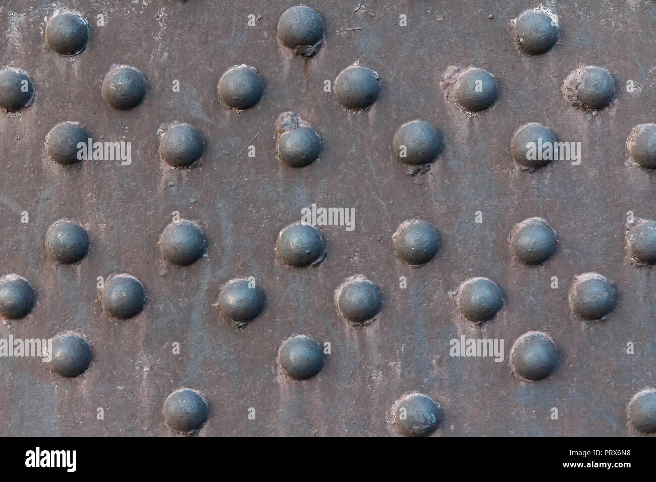 Rusty metal surface with hemispherical texture. Background texture ...