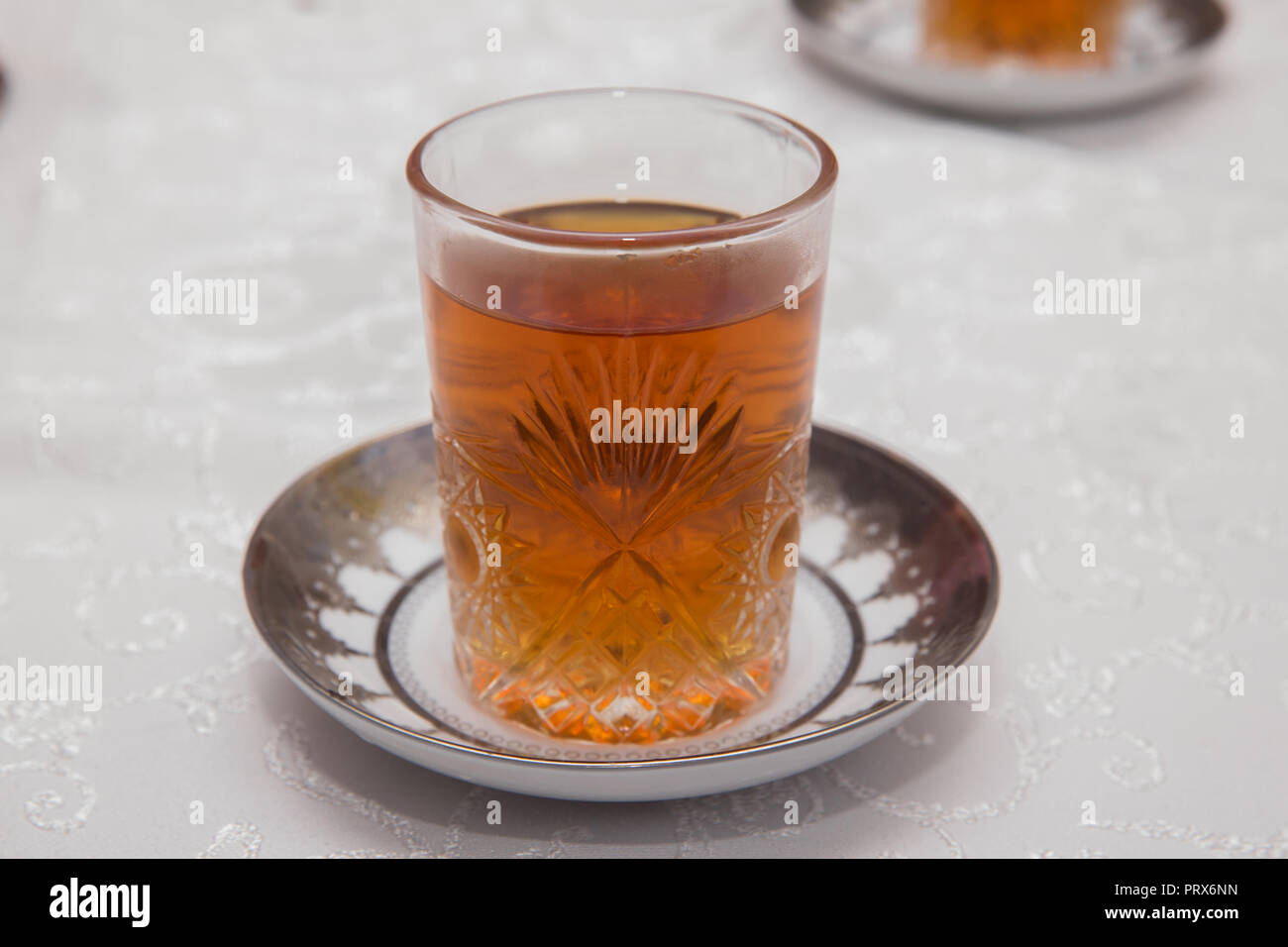 Azerbaijan tea in traditional glass on tray closeup Stock Photo - Alamy