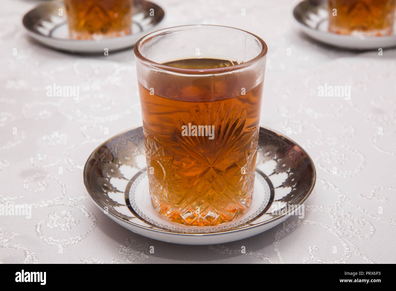 Azerbaijan tea in traditional glass on tray closeup Stock Photo - Alamy