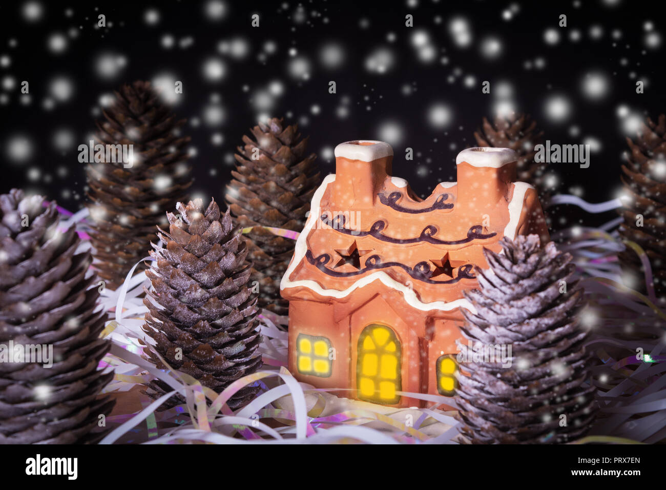 Toy house for candle with cone tree and snow, christmas concept, card ...