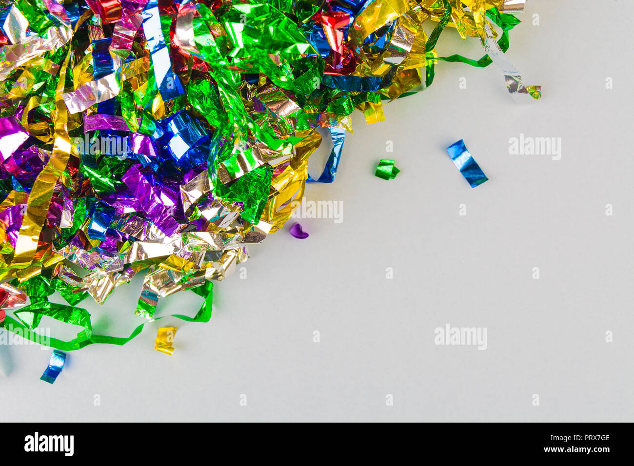 Colorful festive confetti over gray background, overhead view, Copy ...