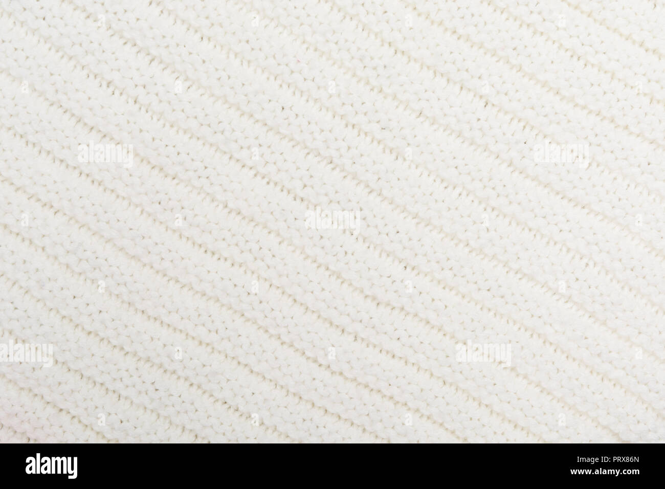 White knitted warm pattern textured background design Stock Photo - Alamy