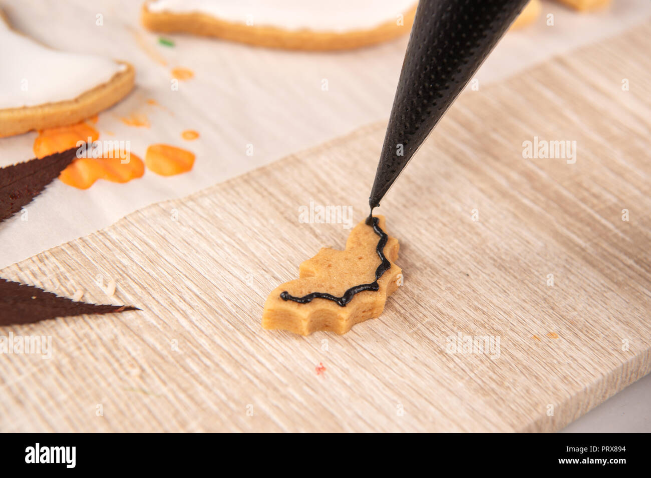 Fresh homemade decorating halloween cookies with ghost, creeping spider ...