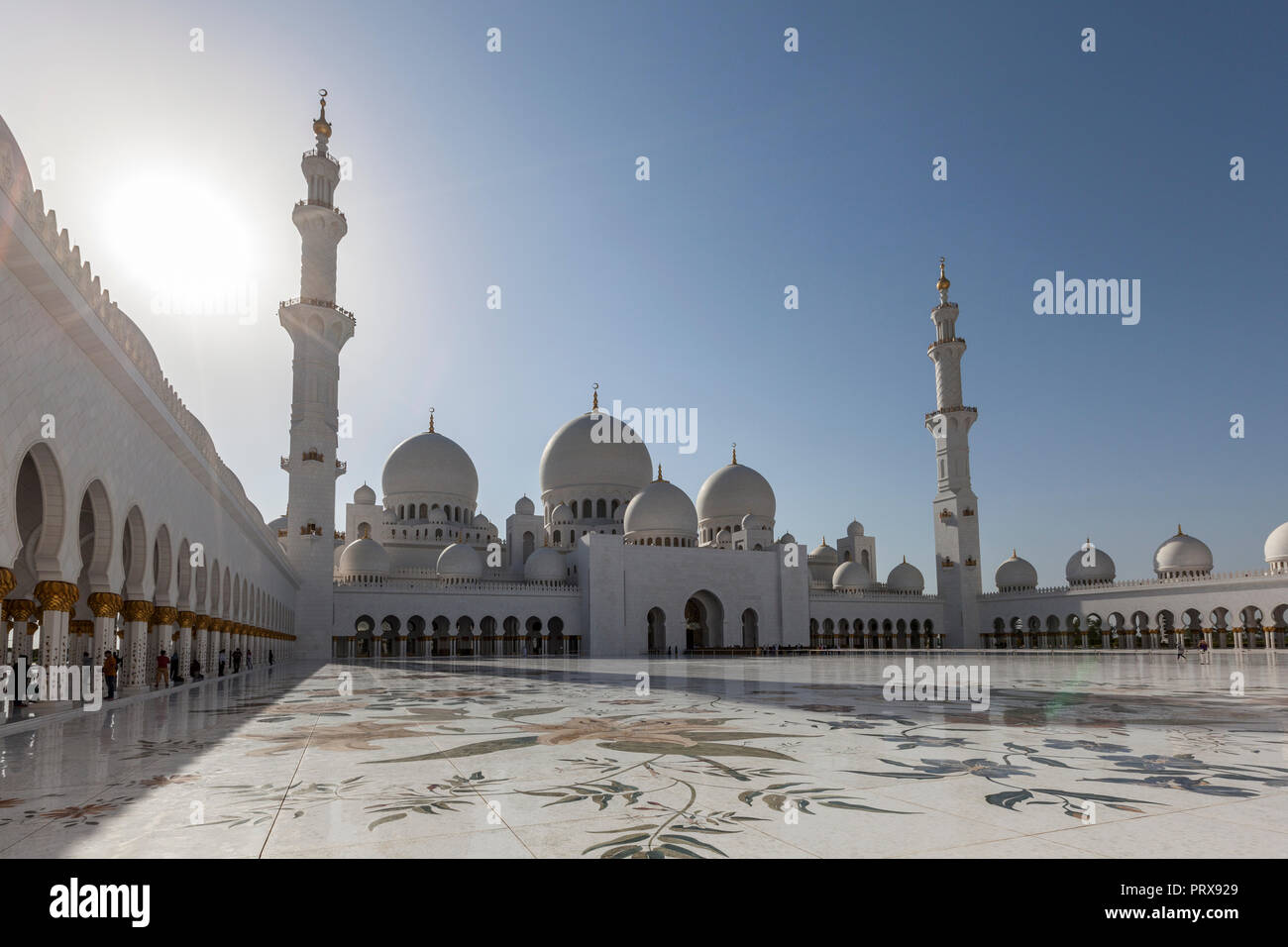 Courtyard of the Sheikh Zayed Grand Mosque is located in Abu Dhabi, the ...