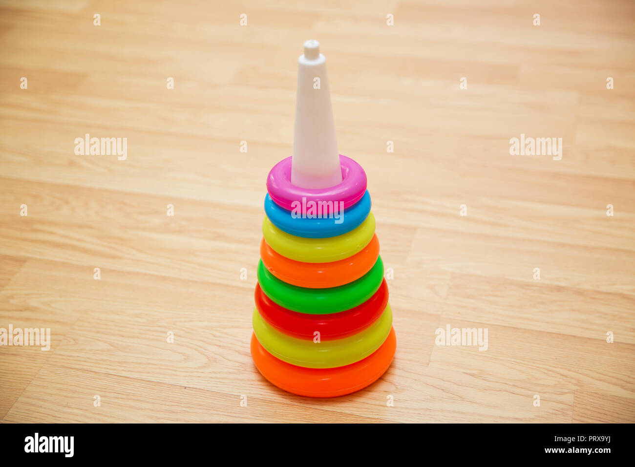 Educational toys for toddlers, gripping rings, isolated on yellow ...