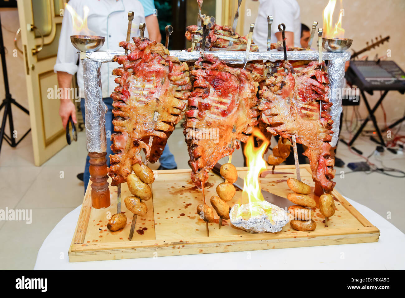 Barbecue is prepared of lamb or sheep meat and processed by slasher ...