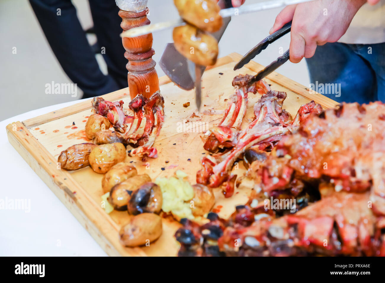 Barbecue is prepared of lamb or sheep meat and processed by slasher ...