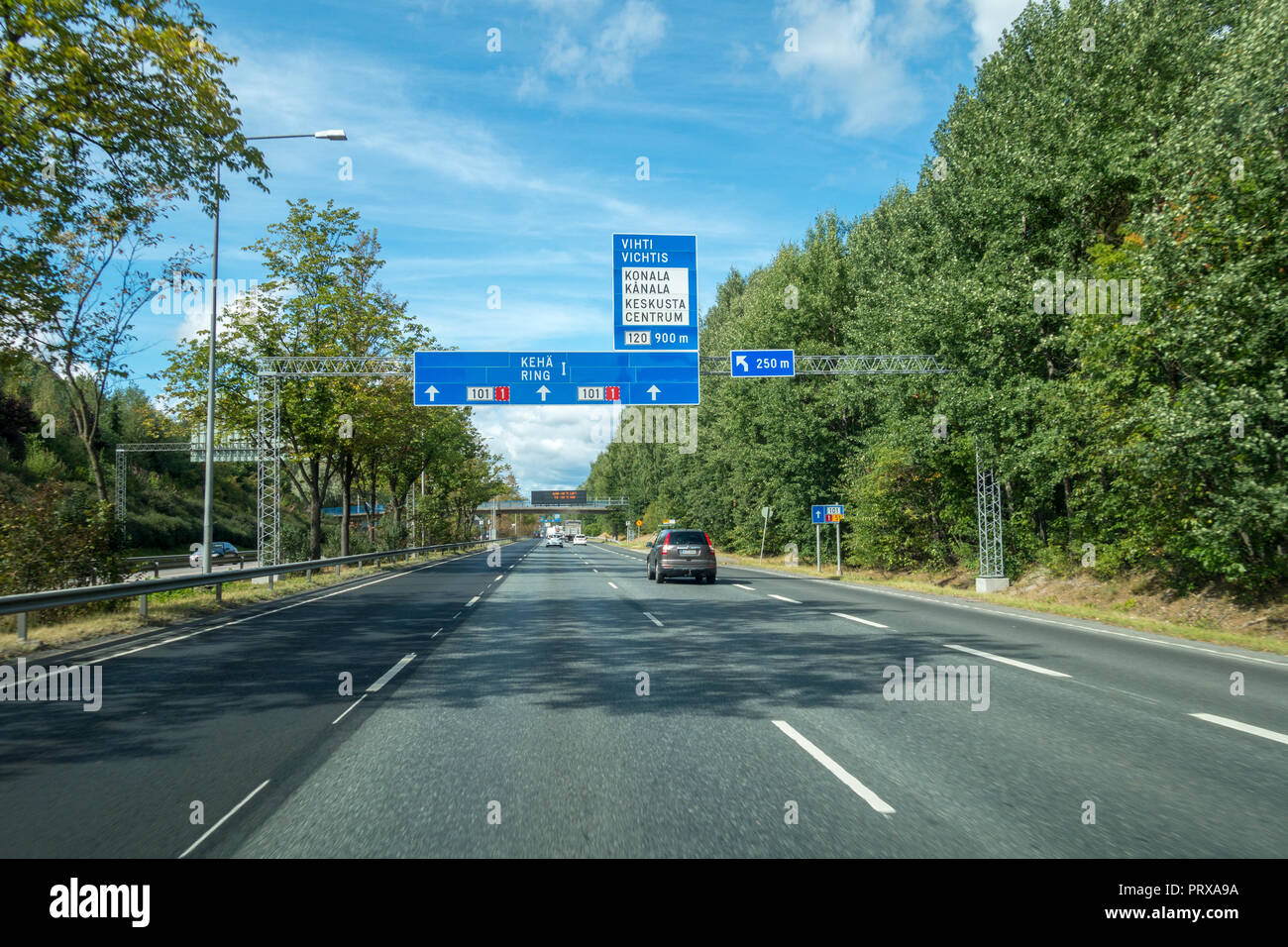 Editorial 08.13.2018 Helsinki Finland, highway on a sunny day with sign ...
