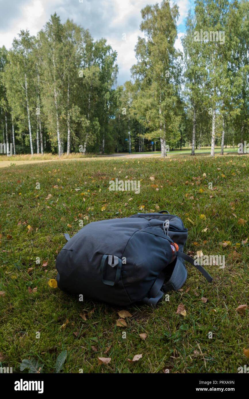 Bag thrown on the ground on a summer day at Helsinki Finland Stock ...