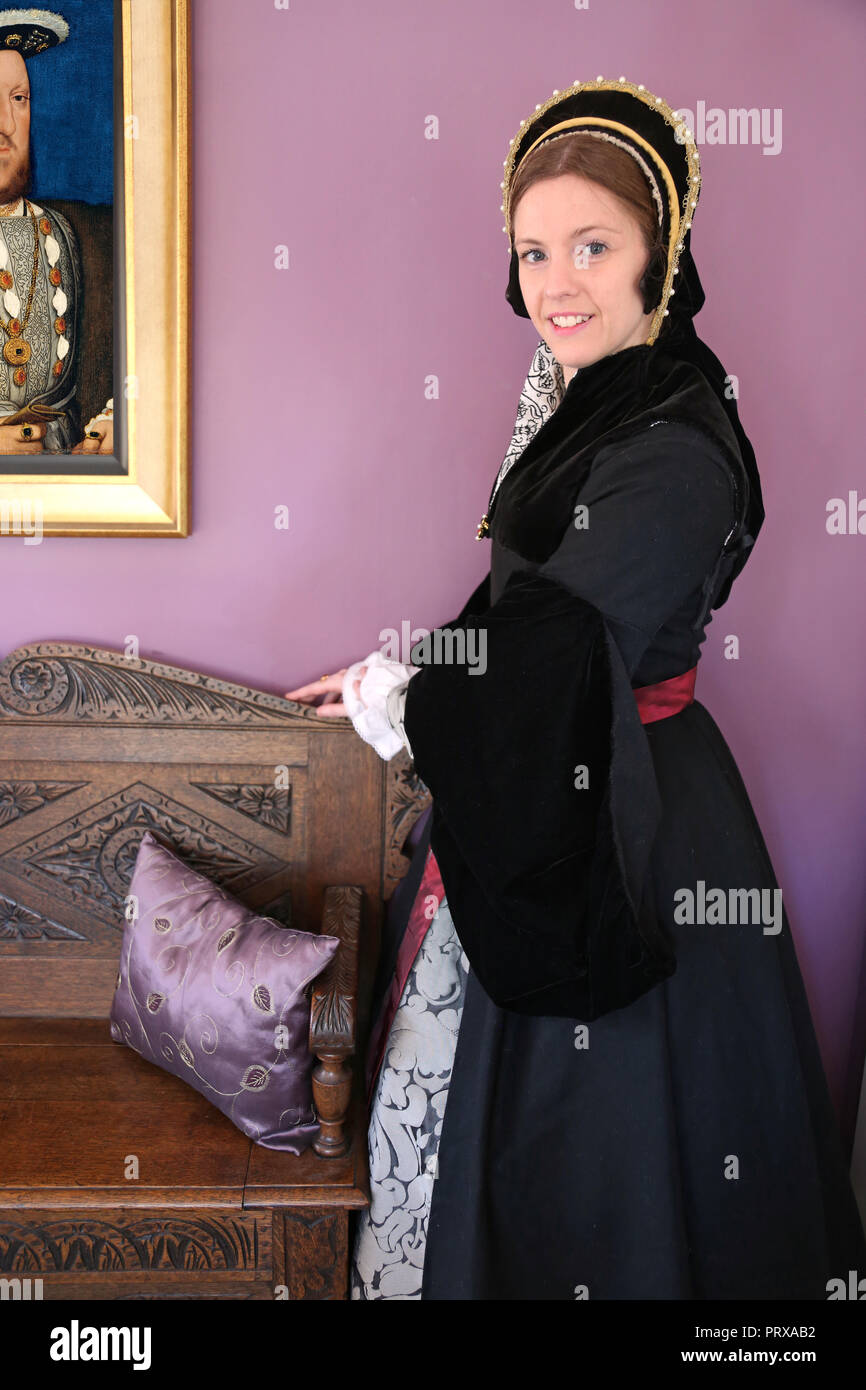 Young woman dressed in Tudor period costume with smiling expression ...