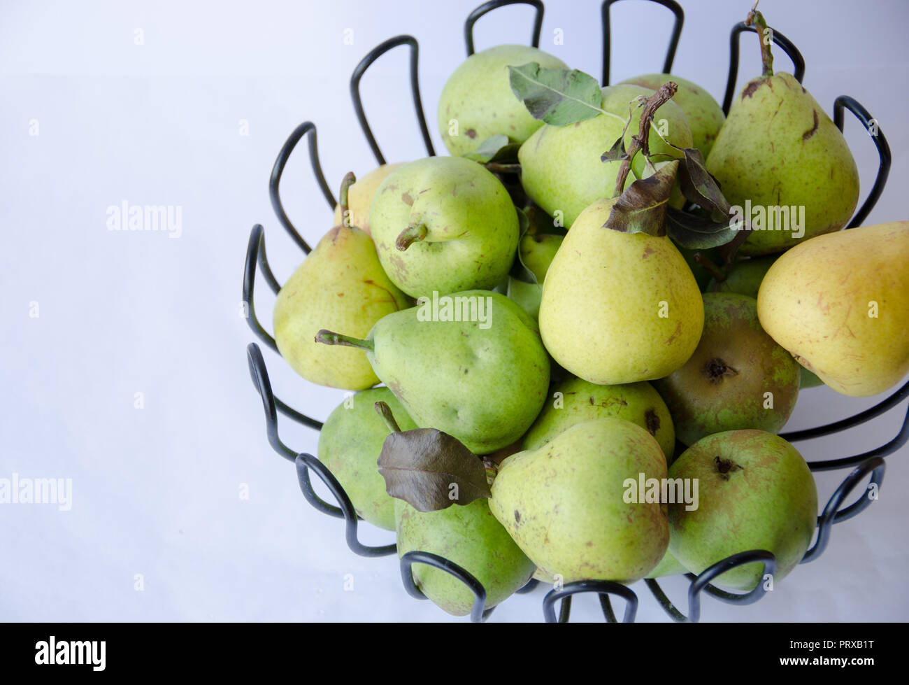 A group of handpicked pears during autumn in a decorative fruitbowl ...