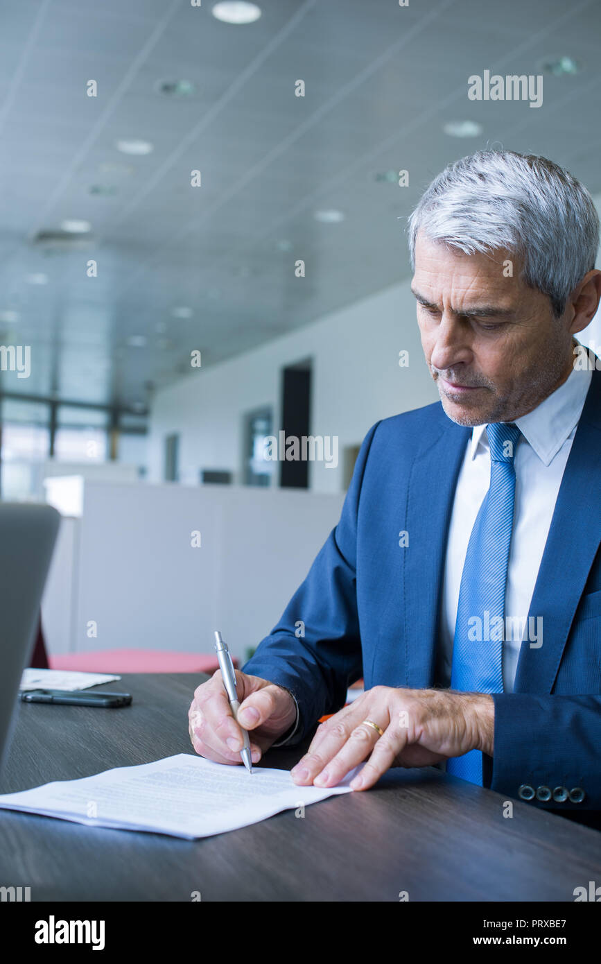 Communication signing document sitting holding hi-res stock photography ...