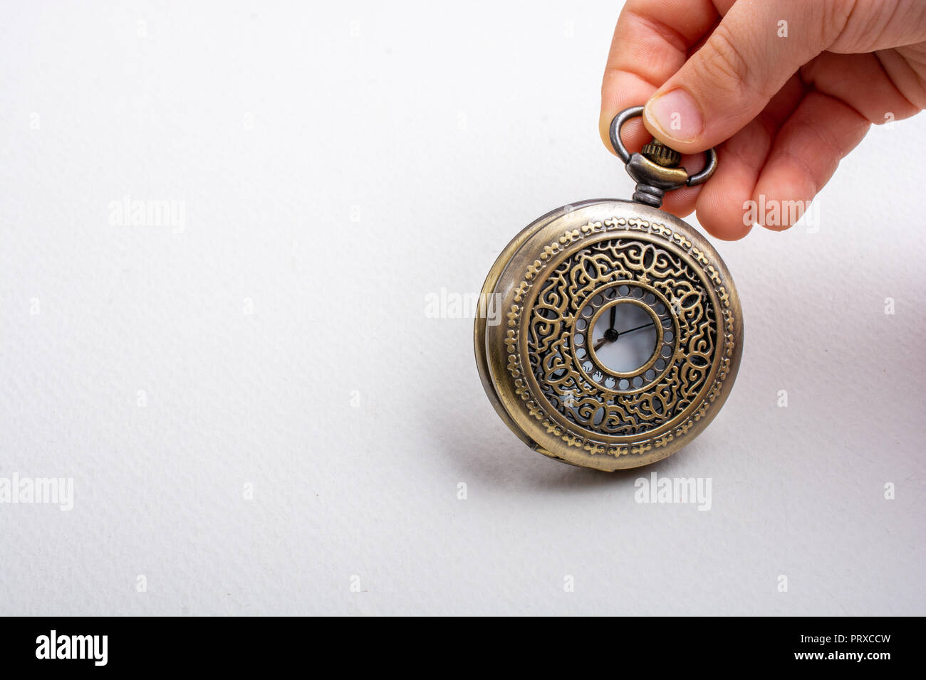 Retro style pocket watch in the hand Stock Photo - Alamy