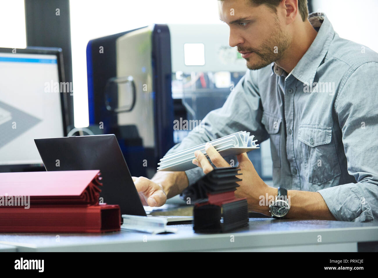 Engineer working in office Stock Photo - Alamy