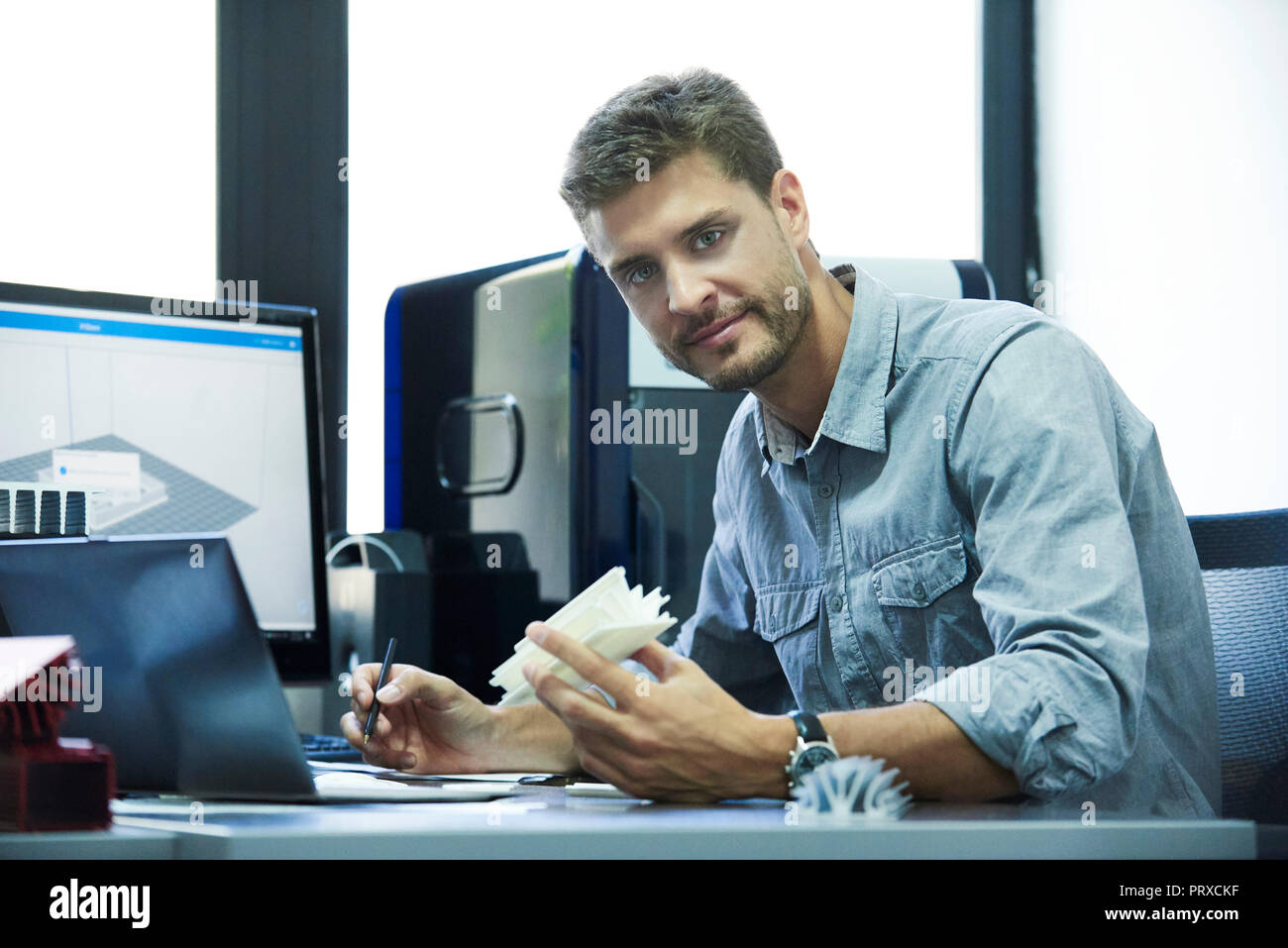 Engineer working in office Stock Photo - Alamy