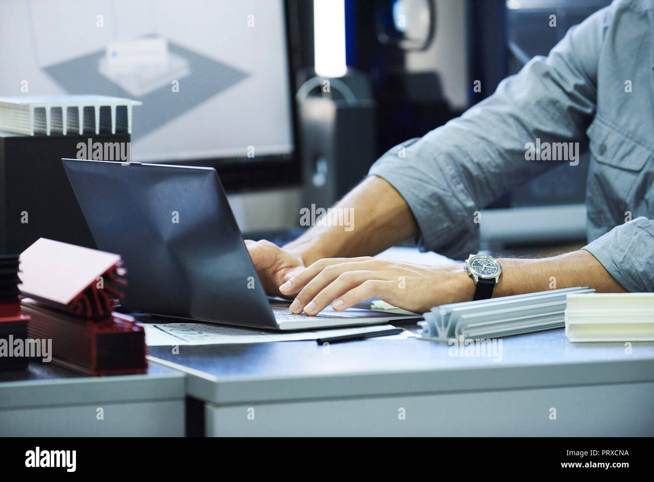 Engineer using laptop Stock Photo - Alamy