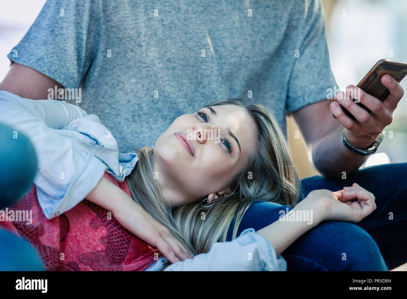 Man lying on lap of a woman hi-res stock photography and images - Alamy