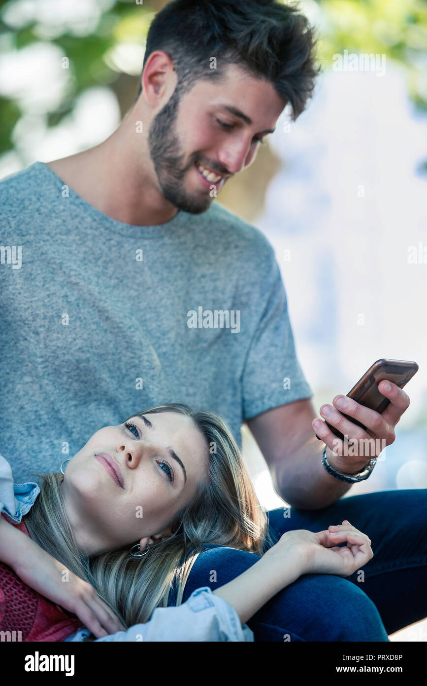 Man lying on lap of a woman hi-res stock photography and images - Alamy