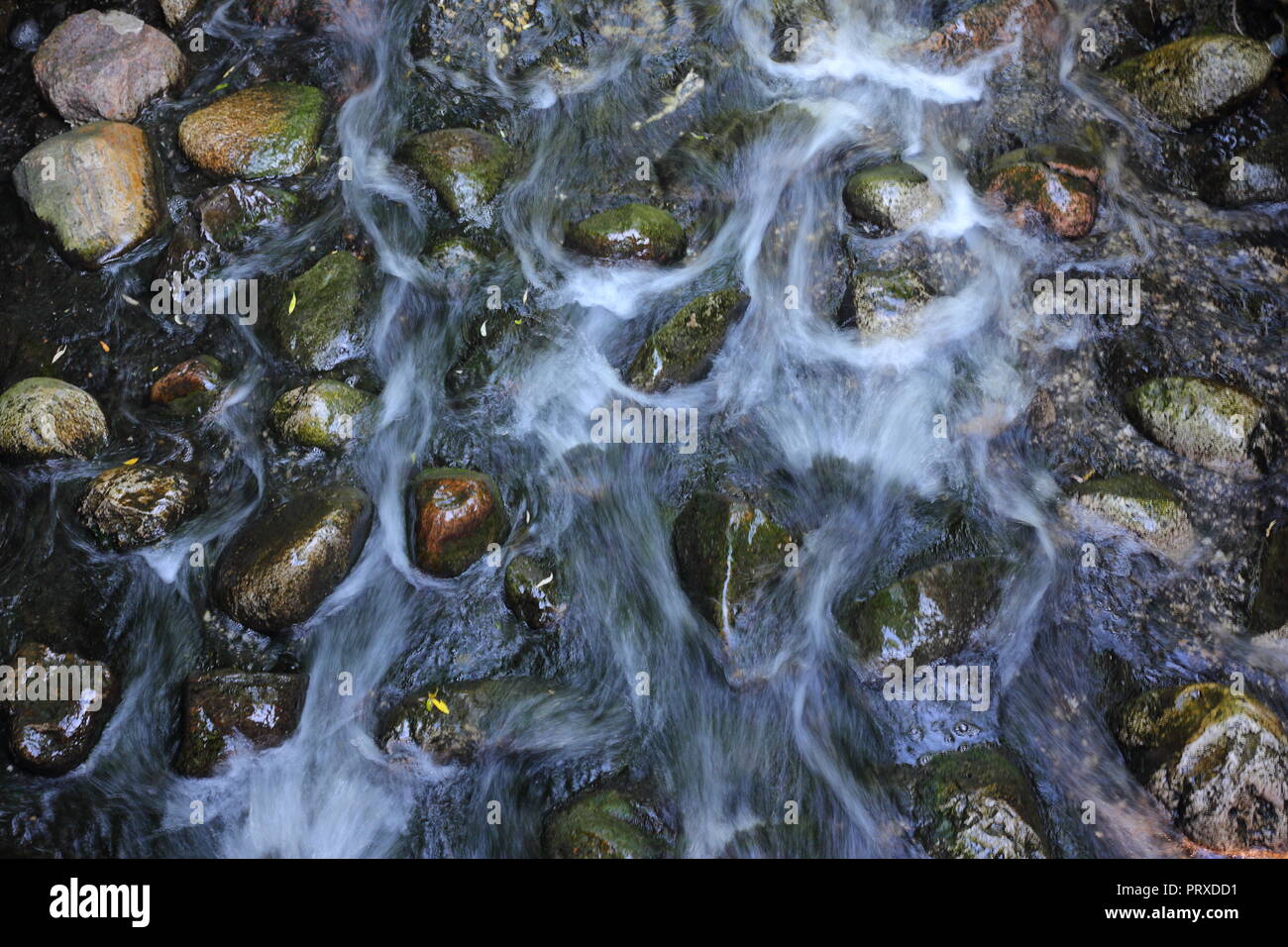 Water rushing over river rocks hi-res stock photography and images - Alamy