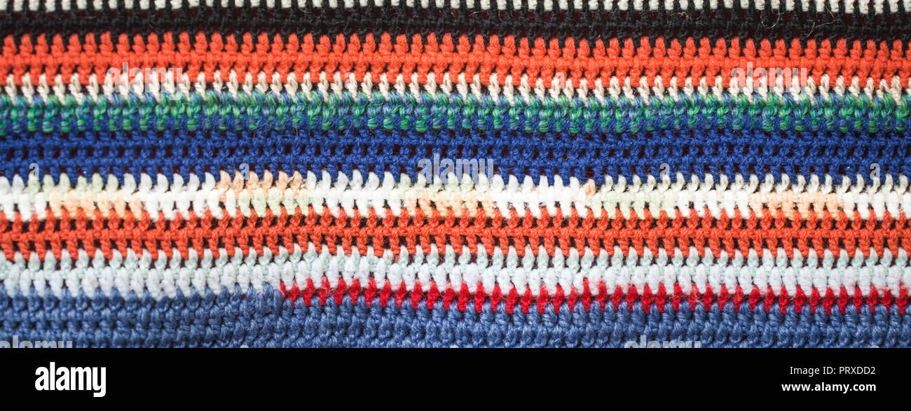 multi-colored knitted cosy texture closeup background,the concept of ...