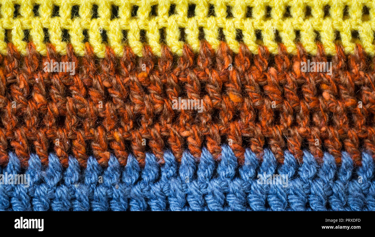 multi-colored knitted cosy texture closeup background,the concept of ...