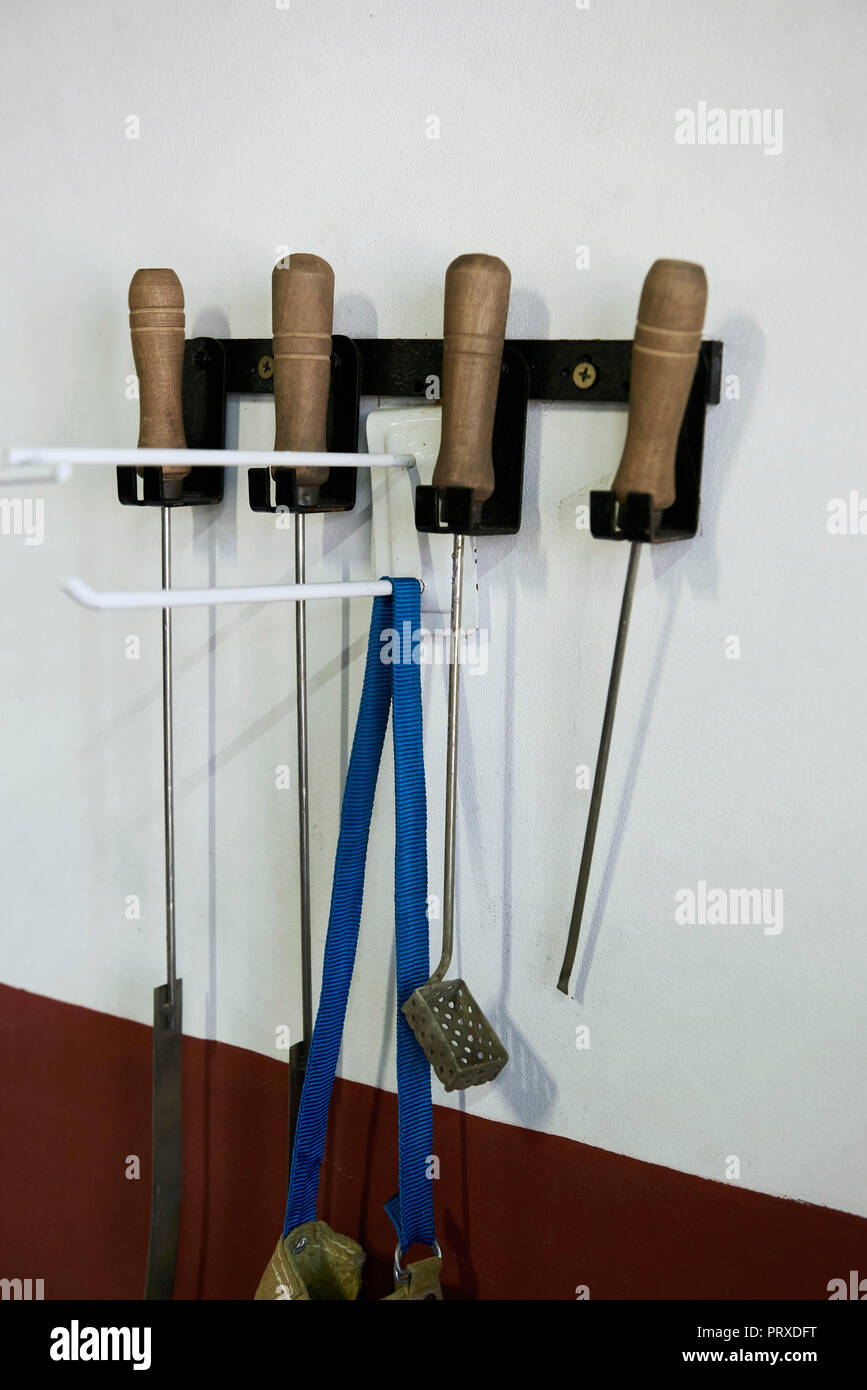 Work tools hanging on wall Stock Photo - Alamy