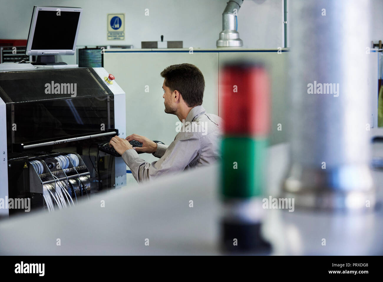 Engineer using computer in office Stock Photo - Alamy