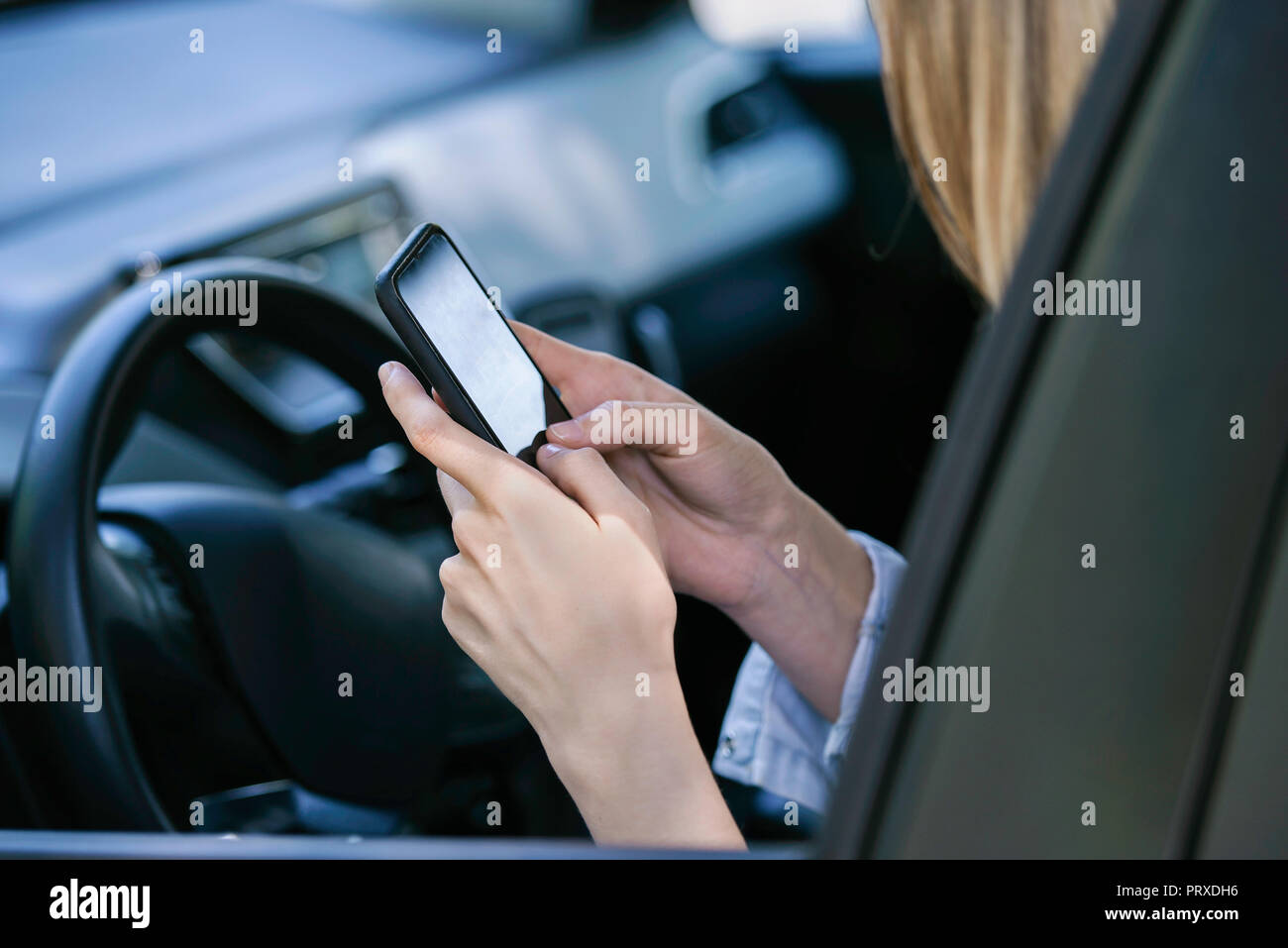 Young blonde woman using hair hi-res stock photography and images - Alamy