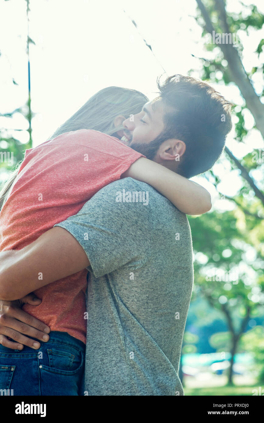 Couple bonding carrying embracing hugging hi-res stock photography and ...