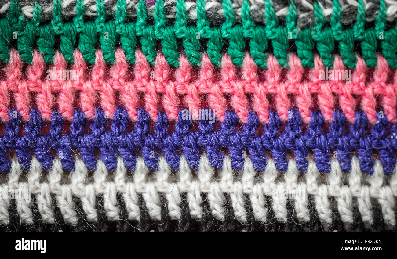 multi-colored knitted cosy texture closeup background,the concept of ...