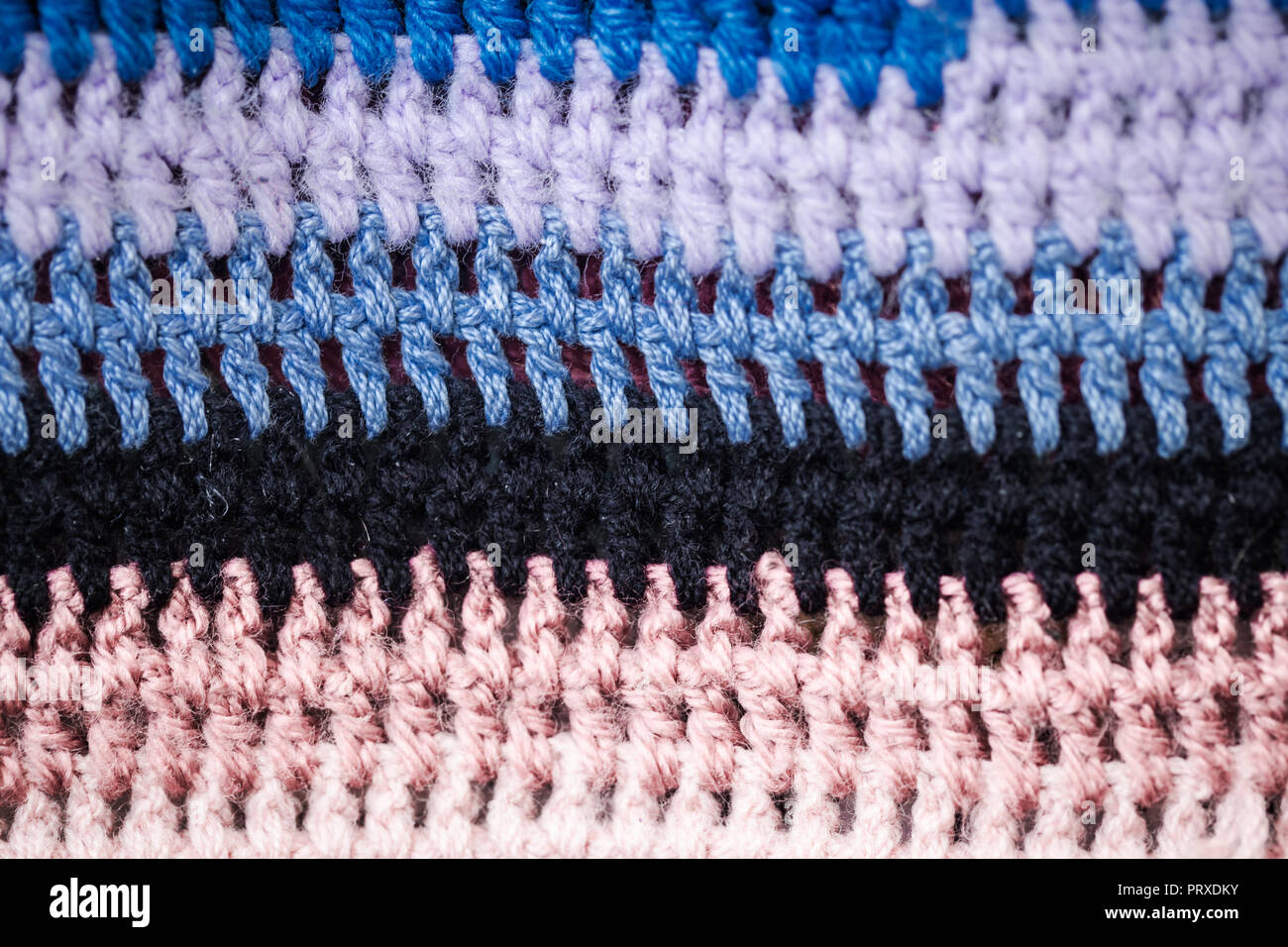 multi-colored knitted cosy texture closeup background,the concept of ...