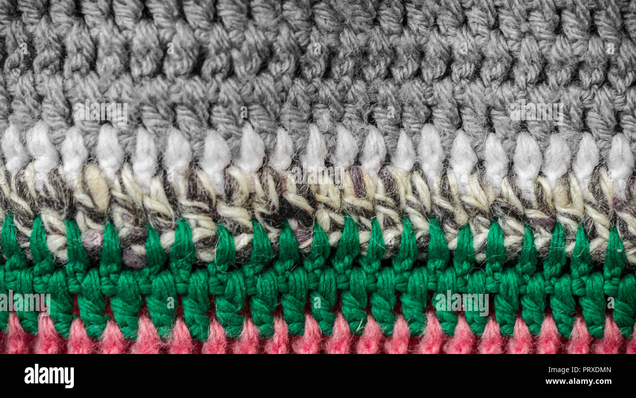 multi-colored knitted cosy texture closeup background,the concept of ...