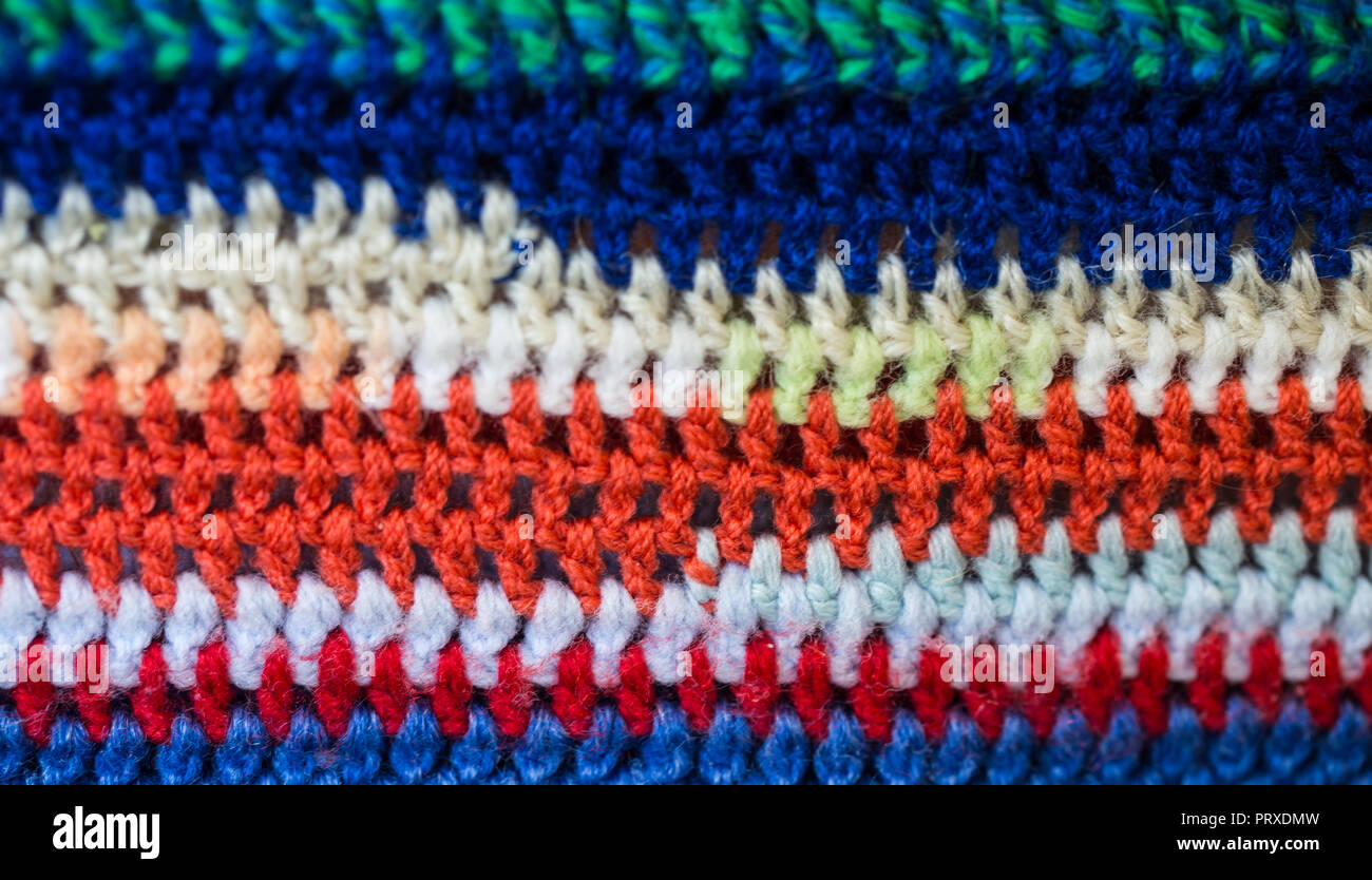 multi-colored knitted cosy texture closeup background,the concept of ...
