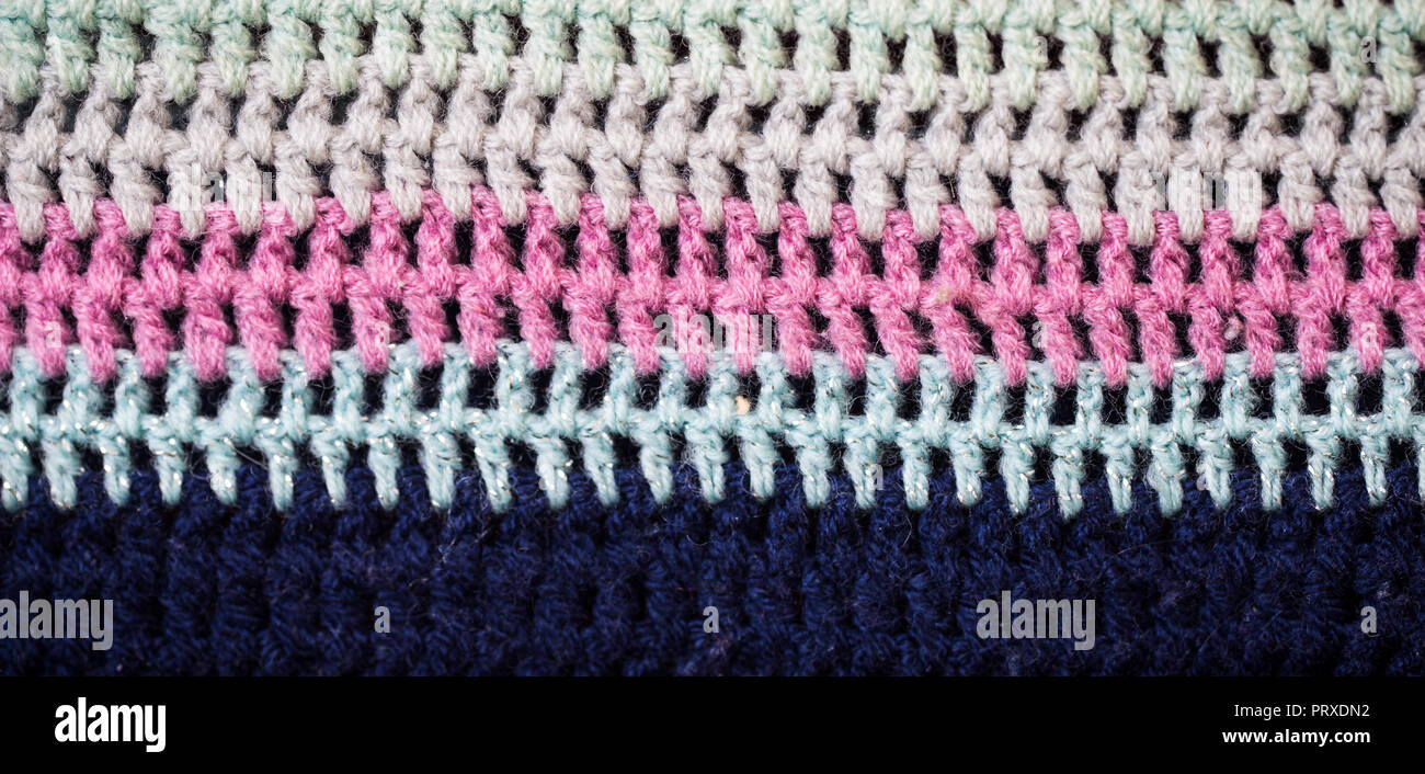 multi-colored knitted cosy texture closeup background,the concept of ...