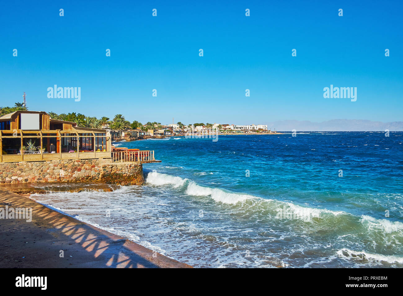 The storm waves in Aqaba Gulf at the coast of Dahab resort, the view on ...