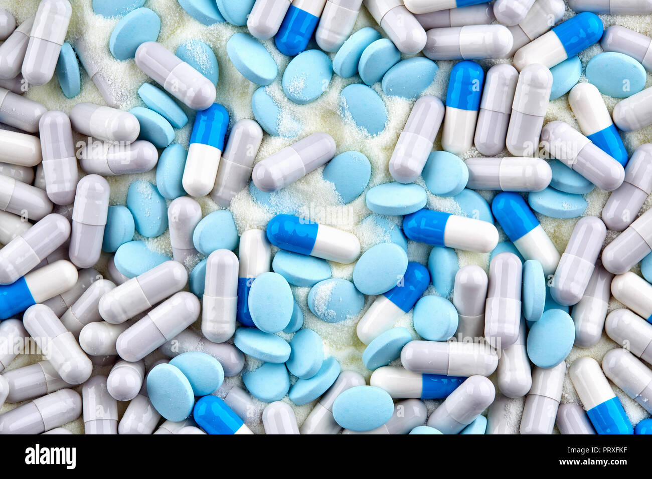 Many blue capsules and tablets. Various pills Stock Photo - Alamy
