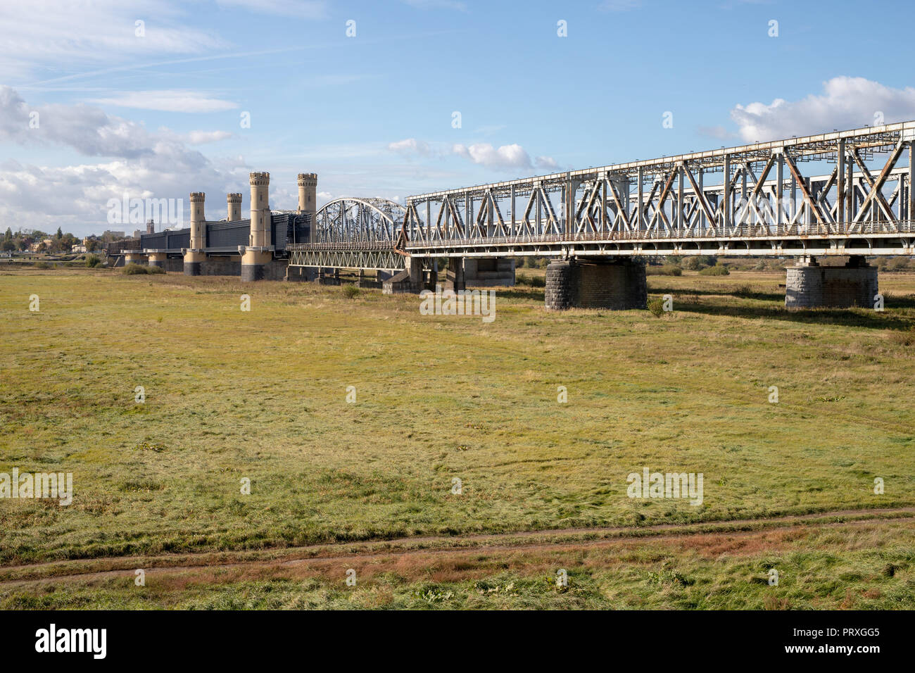 Old railway bridge with pedestrian barriers. Railway bridge over the ...