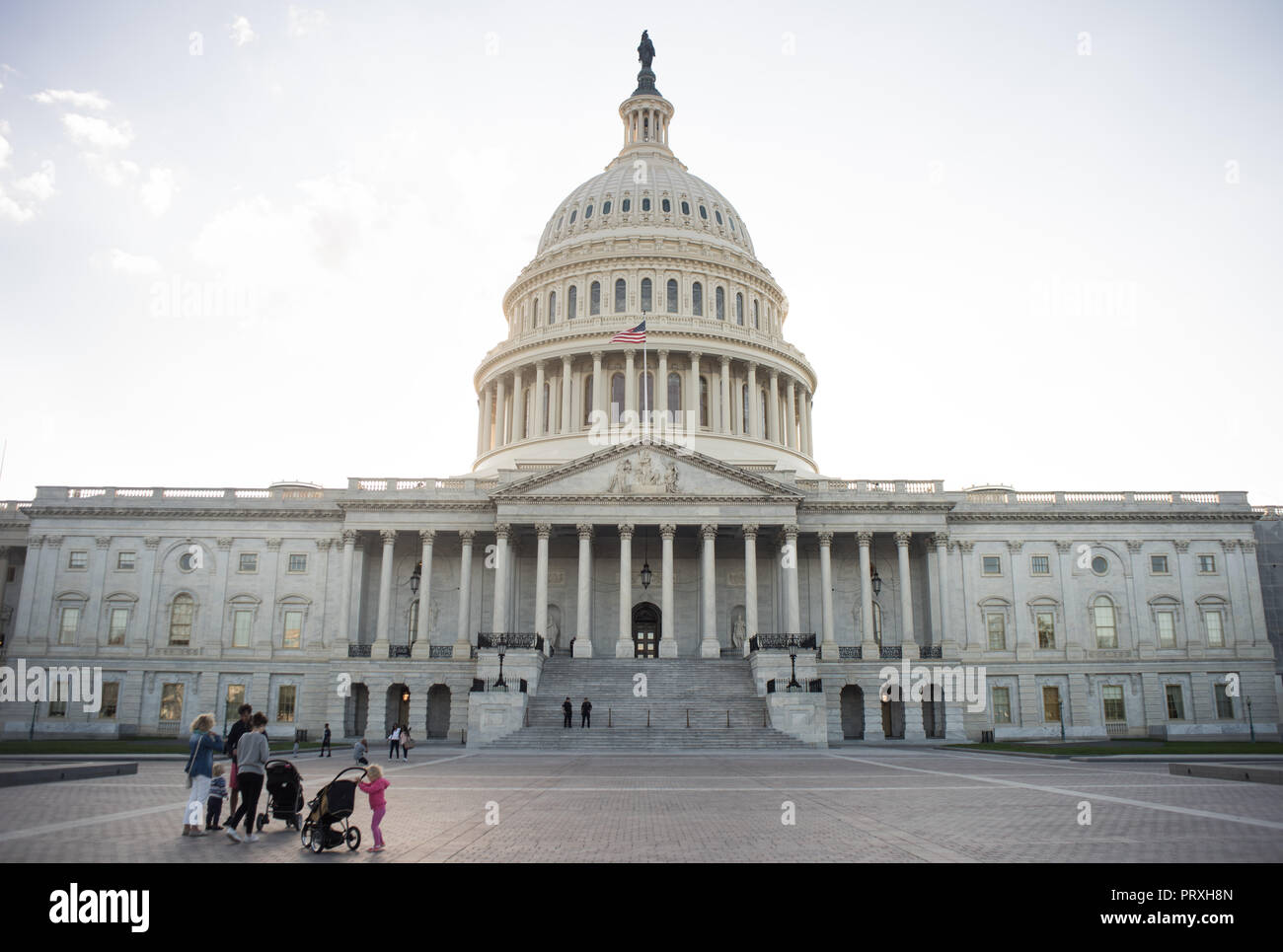 Families look at north side of U.S. capitol building, Washington, DC ...