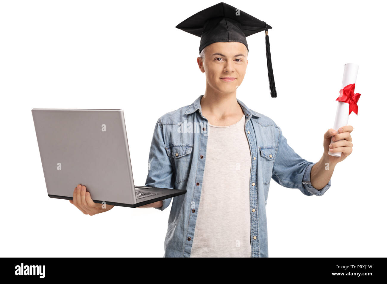 College guy holding a diploma and a laptop computer isolated on white ...
